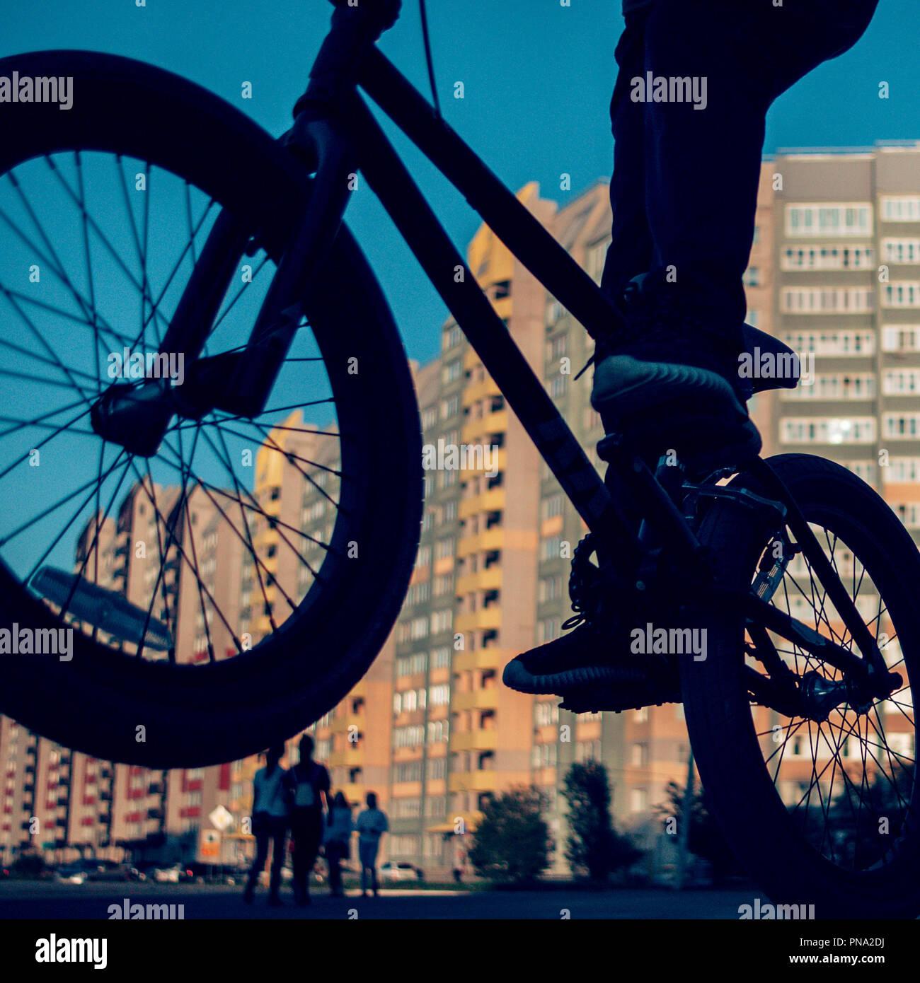 Extreme BMX Freestyle Riding. Blurred Sunset Cityscape, Passersby Stock ...