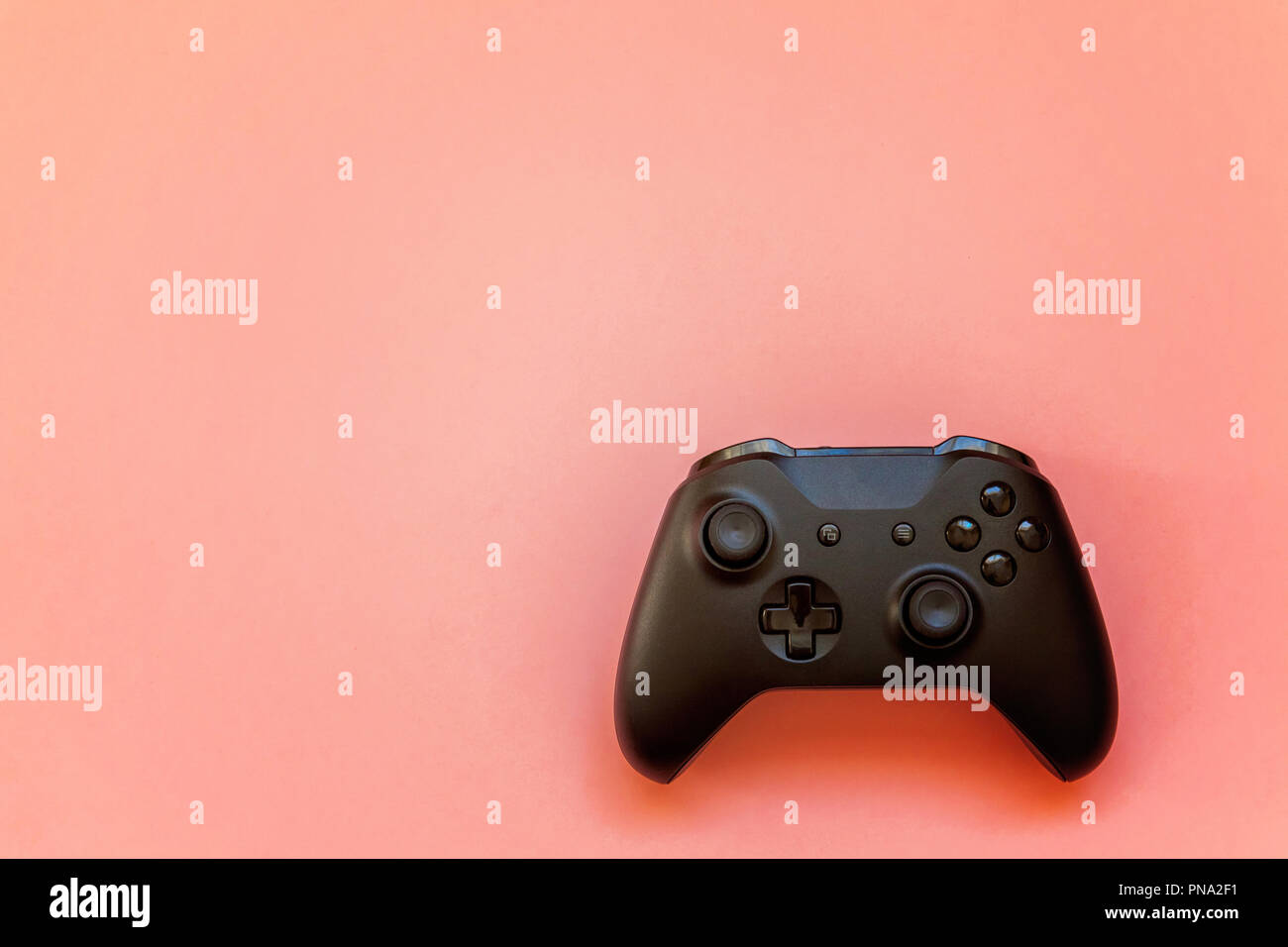 Black joystick gamepad, game console on pink colourful trendy modern ...