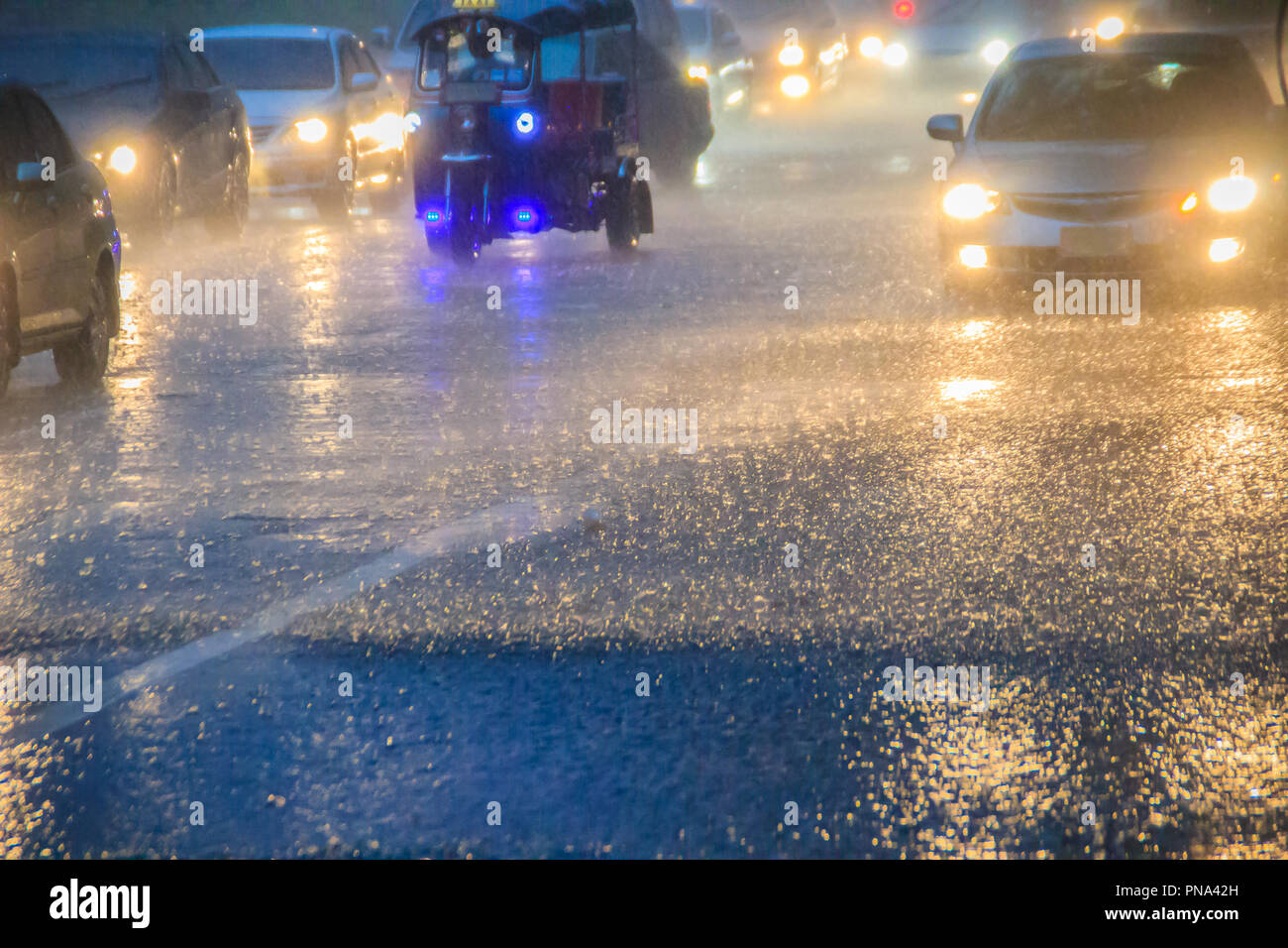 Bangkok, Thailand - July 6. 2017: Driving car through the heavy rain in ...