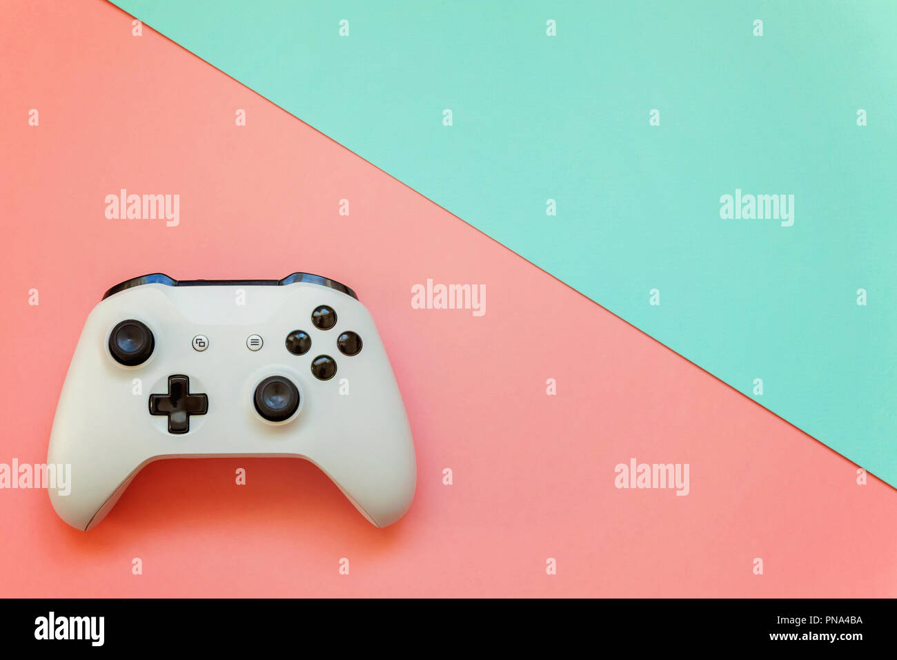 White Joystick Gamepad Game Console On Pink And Blue Colourful Trendy