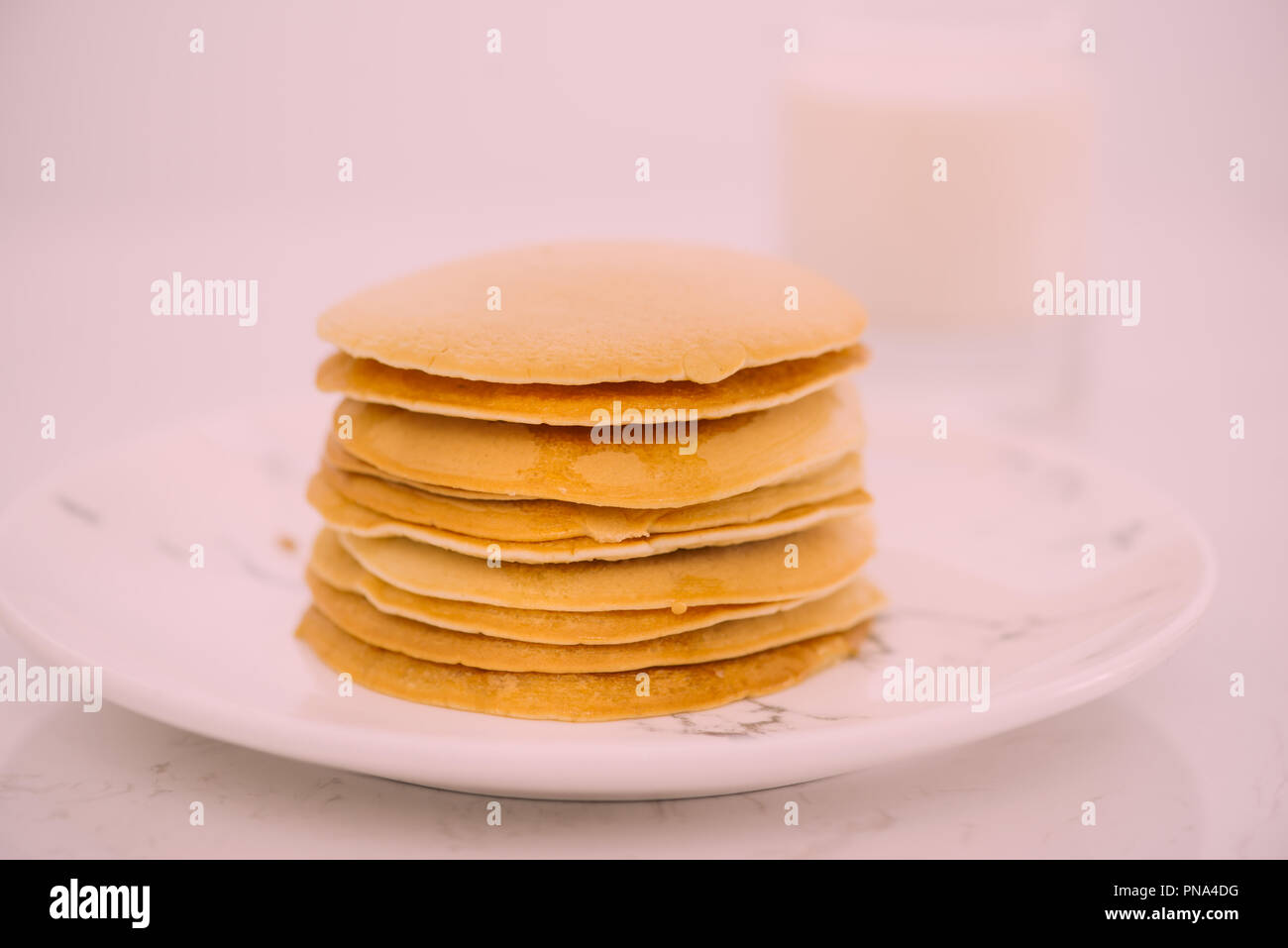 Stack of delicious pancakes on plate isolated on white Stock Photo - Alamy
