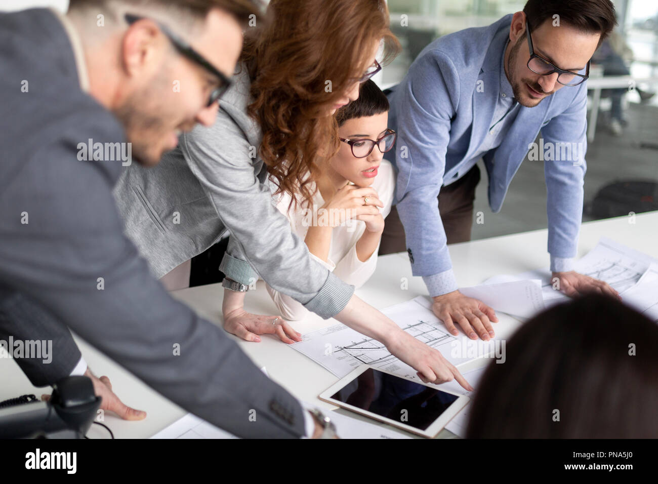 Businesspeople discussing together in conference room during meeting ...
