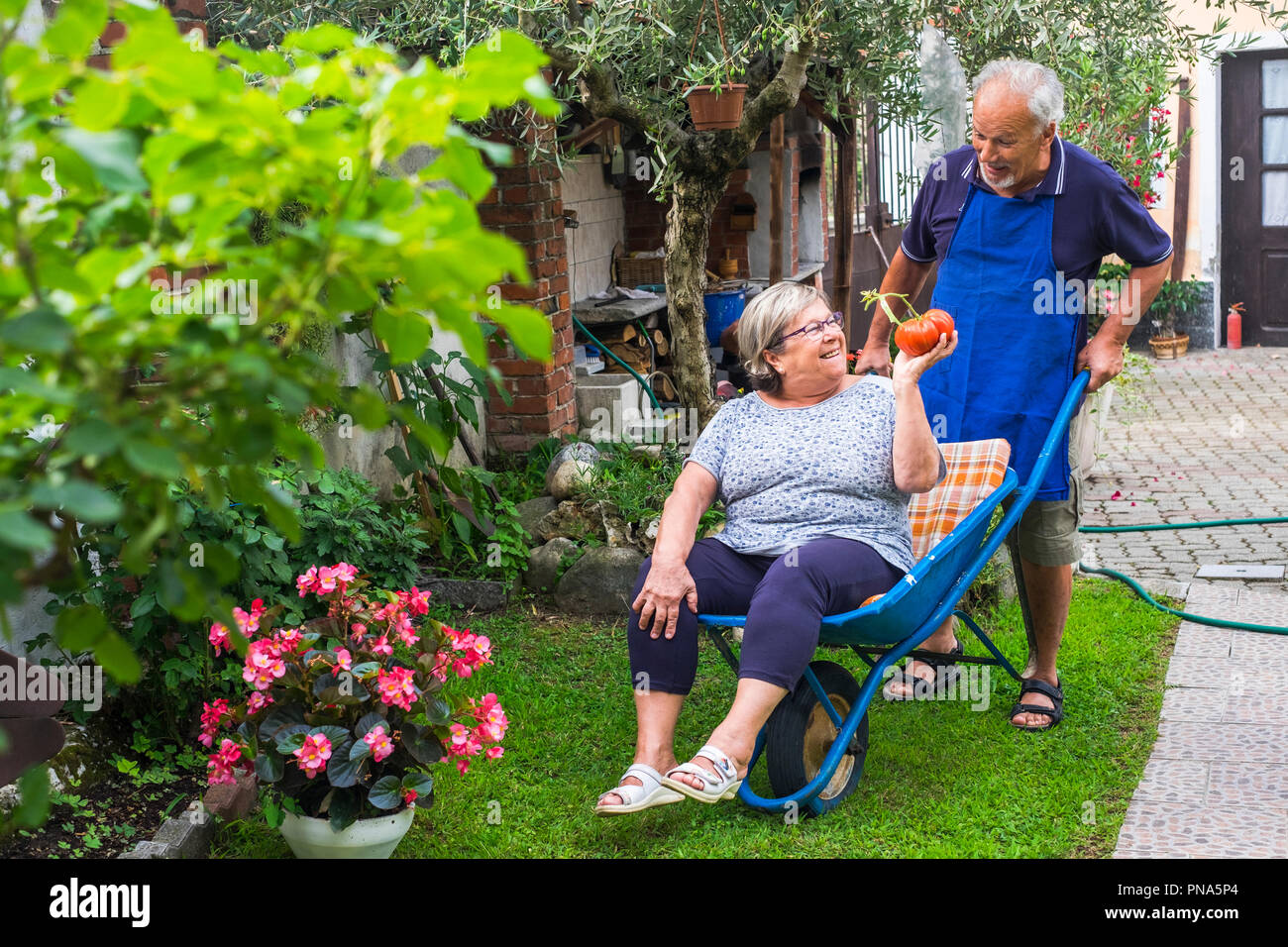 senior happy couple have fun together joking and laughing outside at ...