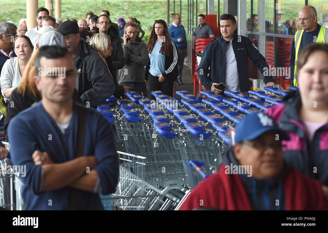 Customers queue outside Tesco's new Jack's store in Chatteris ...