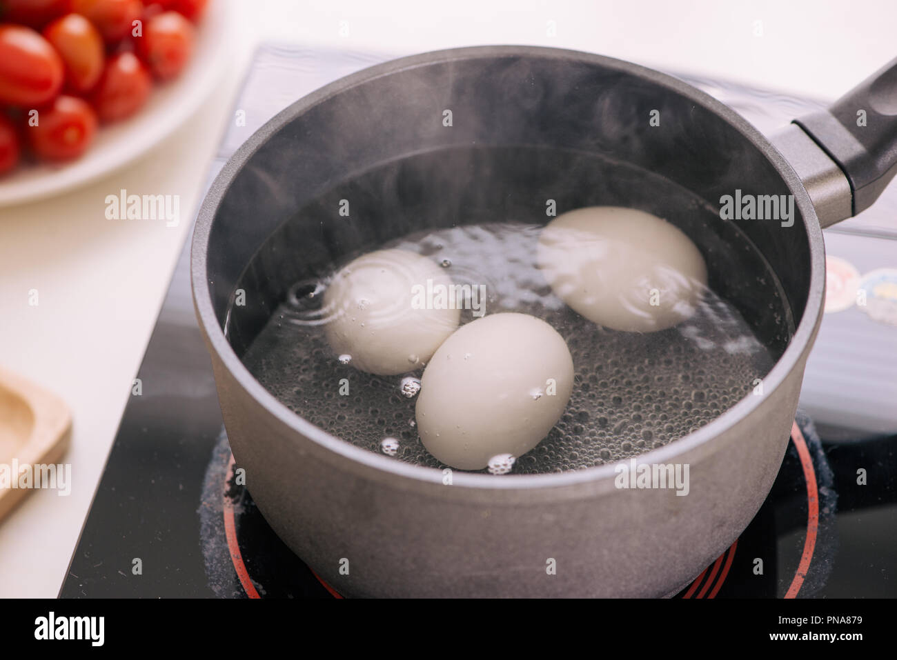 Egg boiled in pot boiling hi-res stock photography and images - Alamy