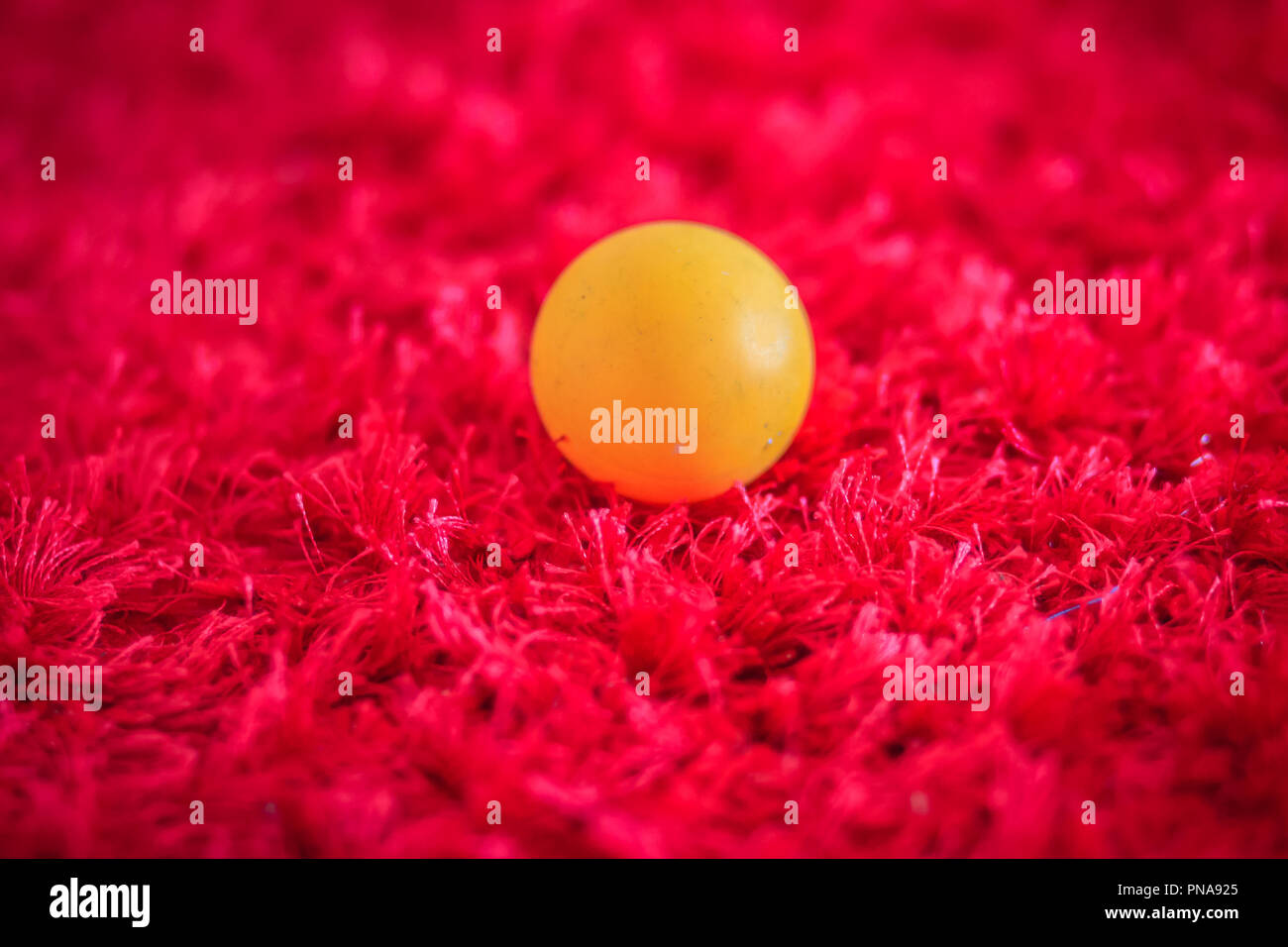 Abstract ping pong ball on the red carpet background Stock Photo - Alamy