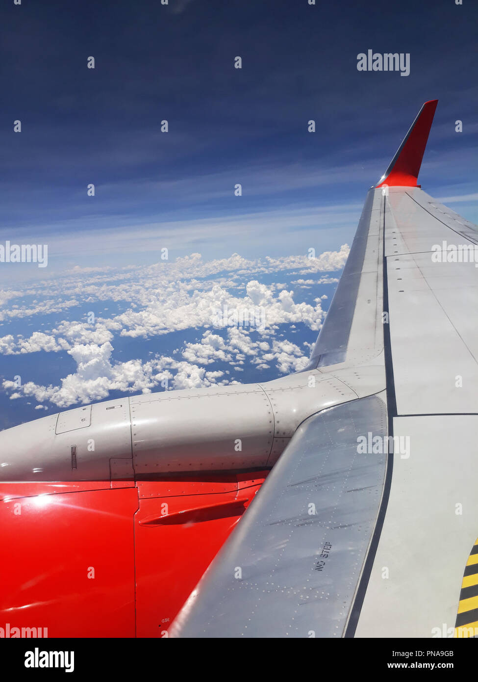 Airplane wing out of window, Traveling concept Stock Photo - Alamy