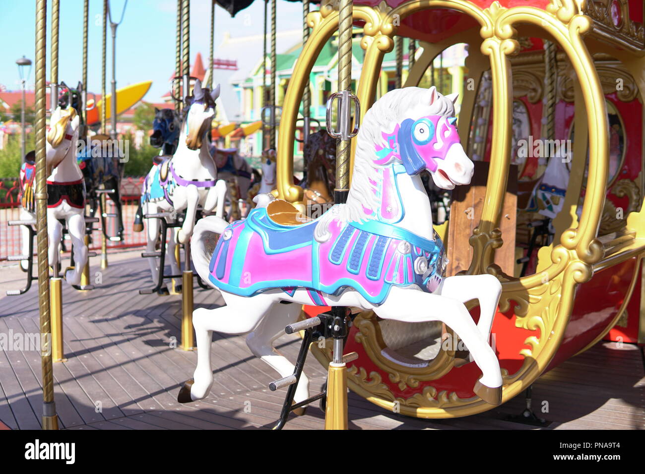 Kid attractions colorful carousel horse fun x Stock Photo - Alamy