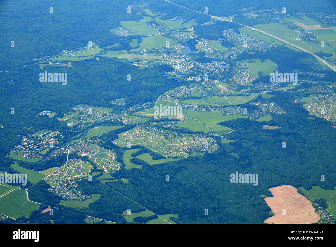 view from height to plain covered with forest Stock Photo - Alamy