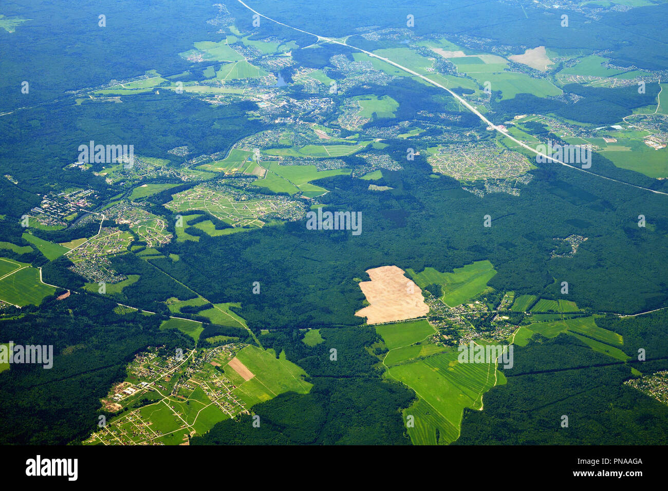 view from height to plain covered with forest Stock Photo - Alamy