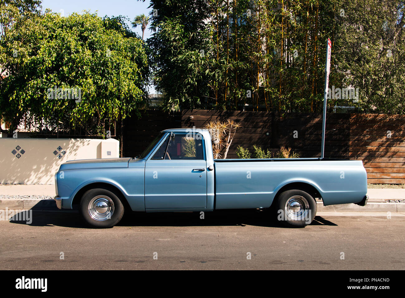 A view of vintage classic American pick up trucks cars in the street ...