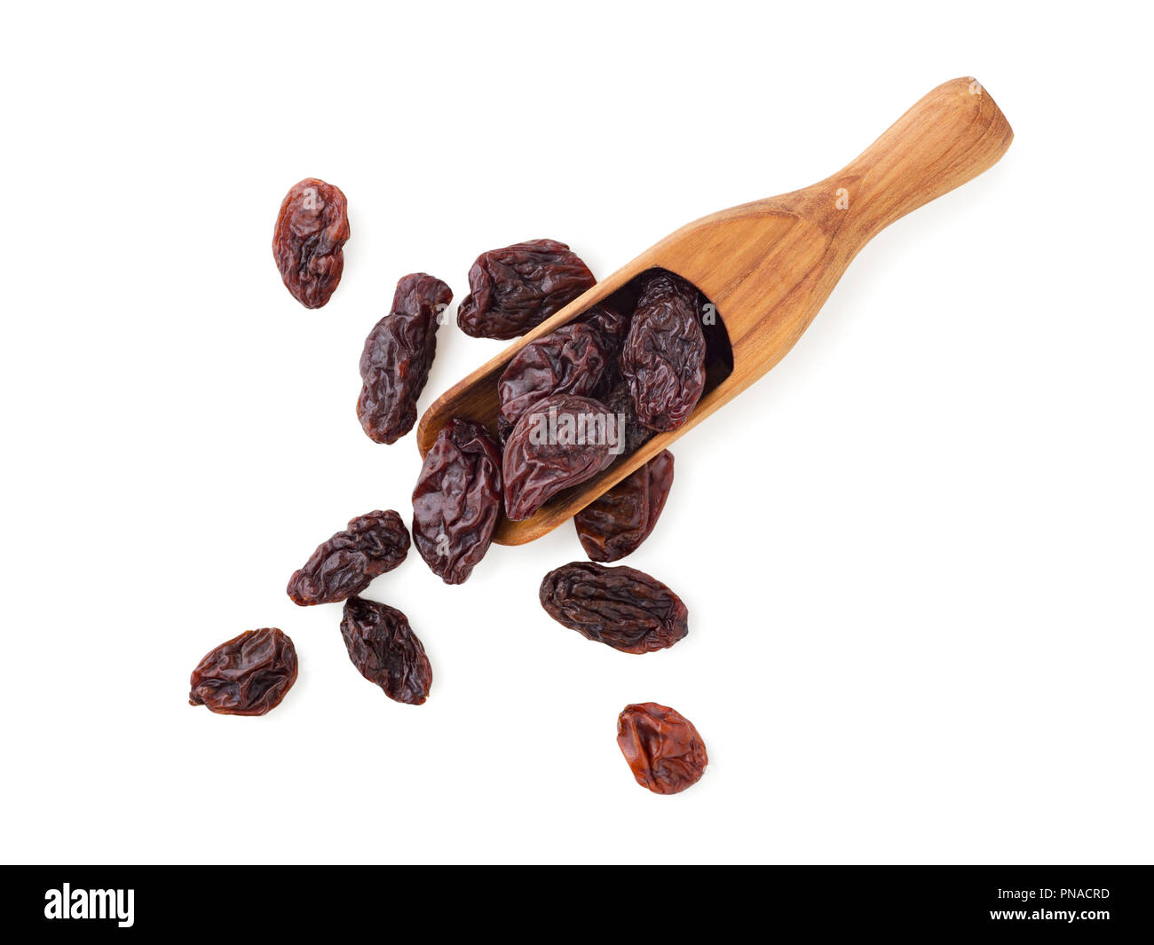 Jumbo raisins in wood scoop isolated on white background Stock Photo ...