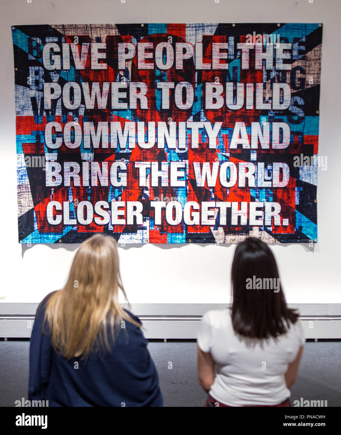 Gallery assistants observe Harvest, renew us! 2018, by Mark Titchner at ...