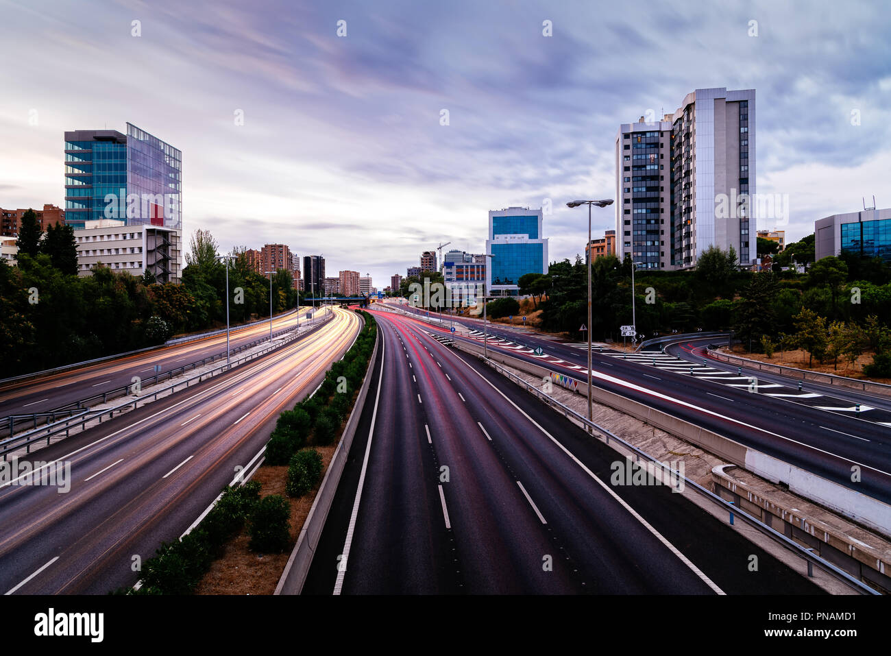 M30 motorway in Madrid at sunset. Long exposure with traffic light ...