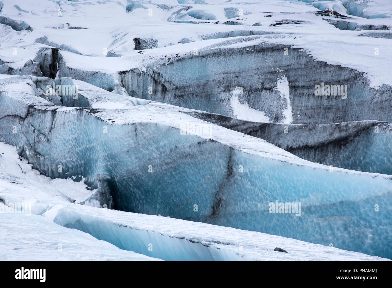 Close up showing layers in ice blocks in glacial tongue of ...