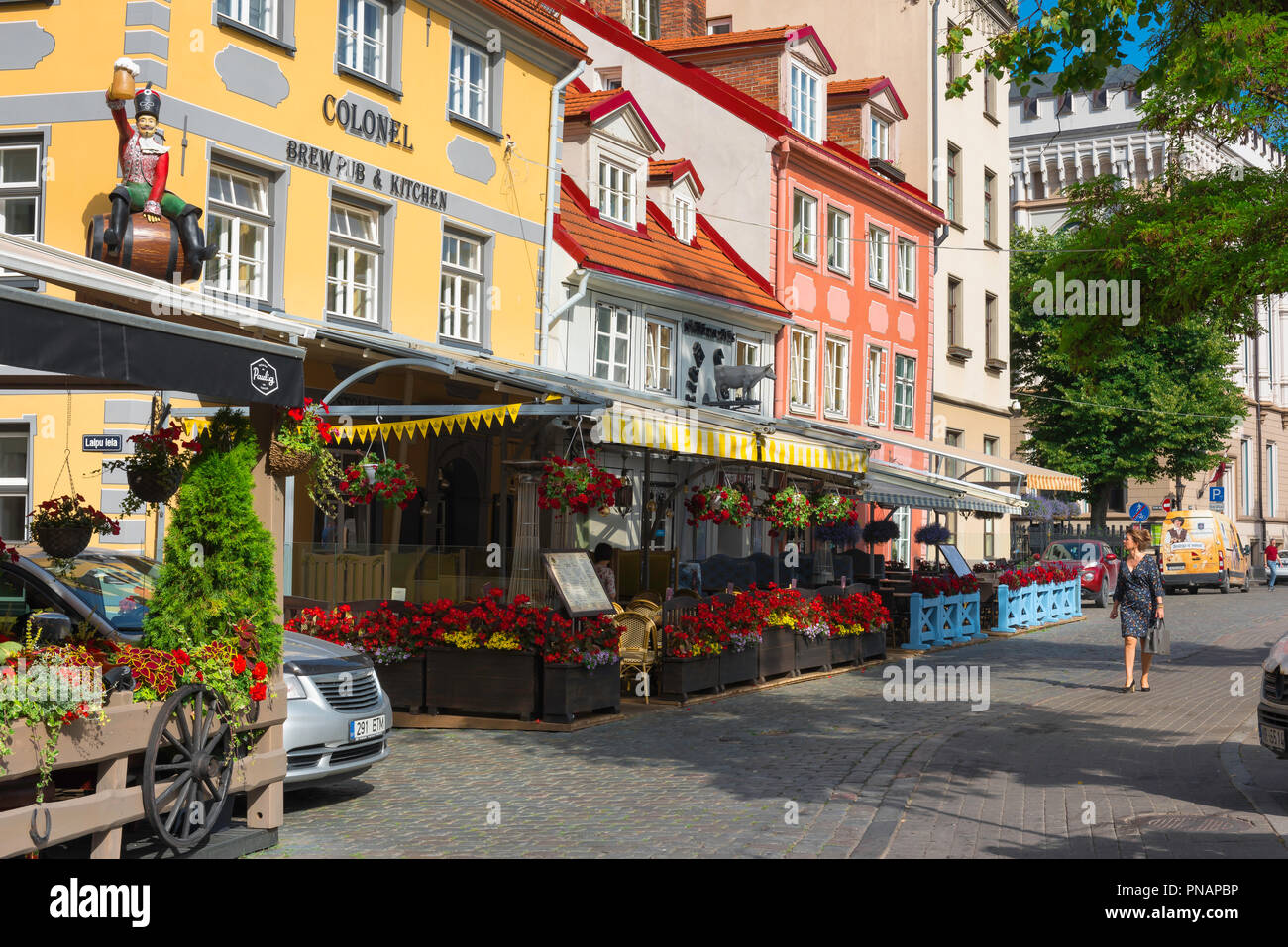 Riga Old Town, view on a summer morning of colorful restaurants and ...