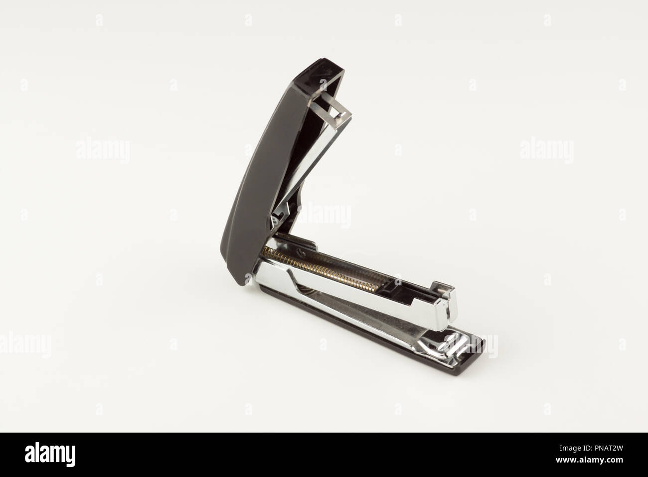 new stapler for stapling papers on a table Stock Photo - Alamy
