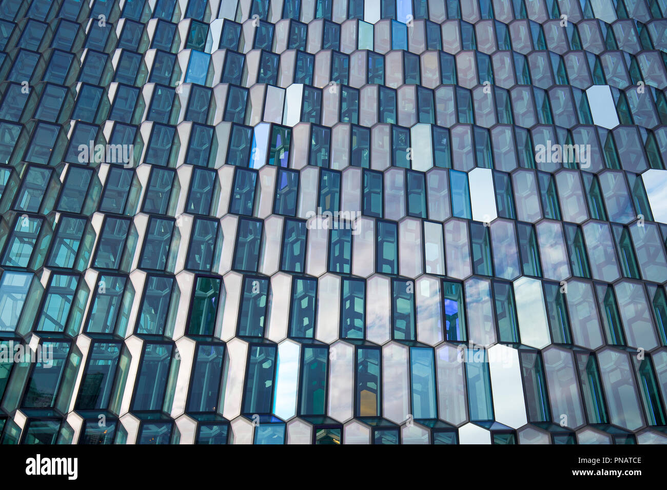 Modern architecture glazing - hexagonal coloured glass in shape of ice ...