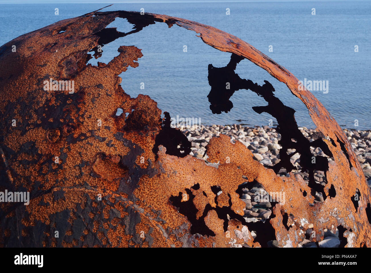 A view of broken, large, discarded iron sea floats on Badentarbat beach ...
