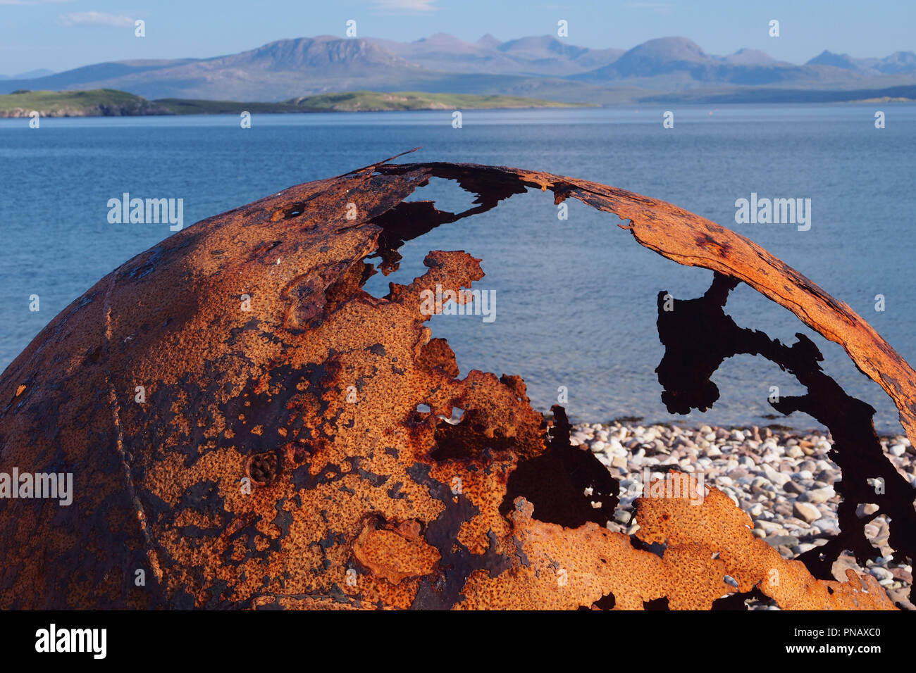 A view of broken, large, discarded iron sea floats on Badentarbat beach ...