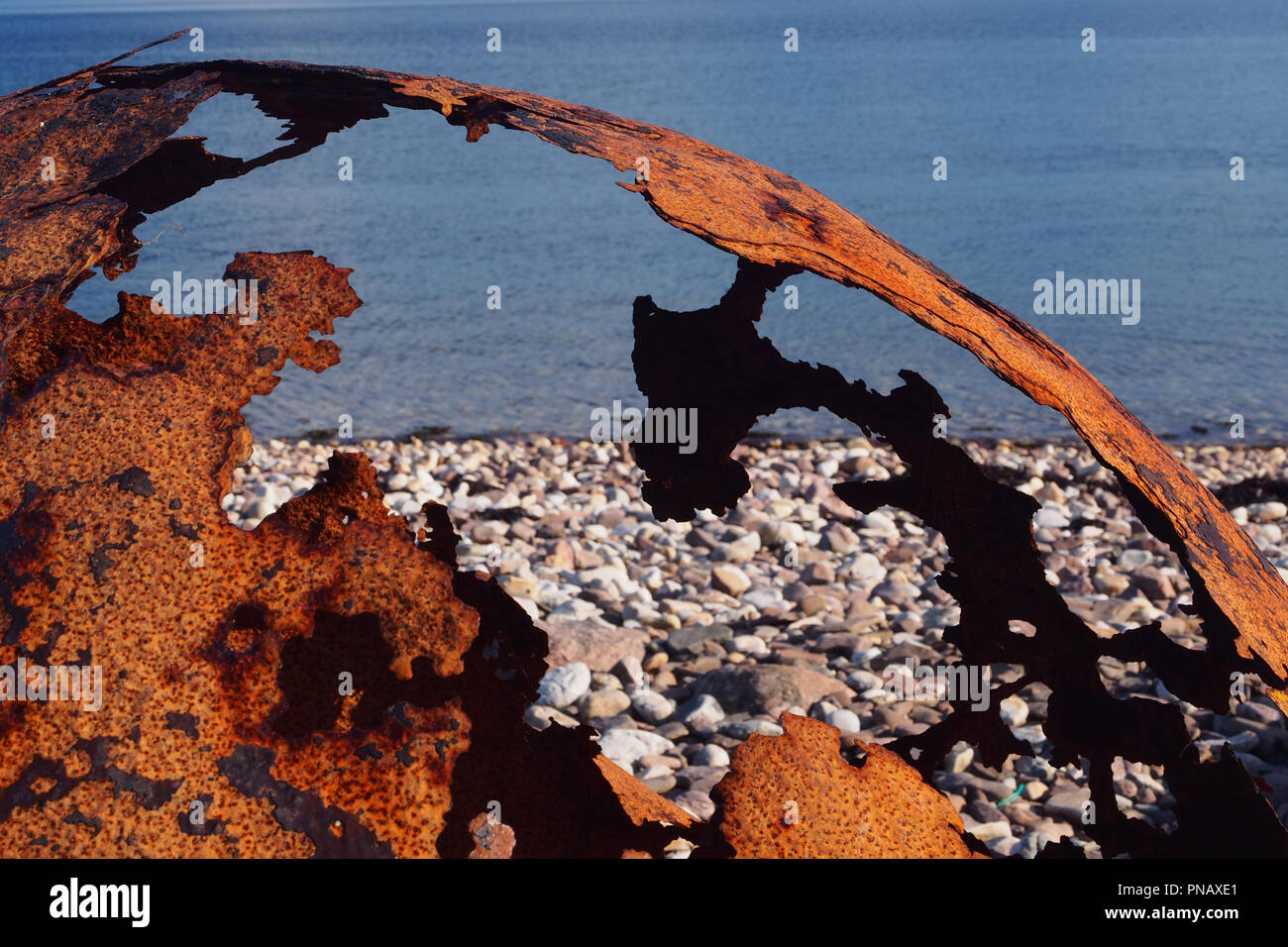 A view of broken, large, discarded iron sea floats on Badentarbat beach ...