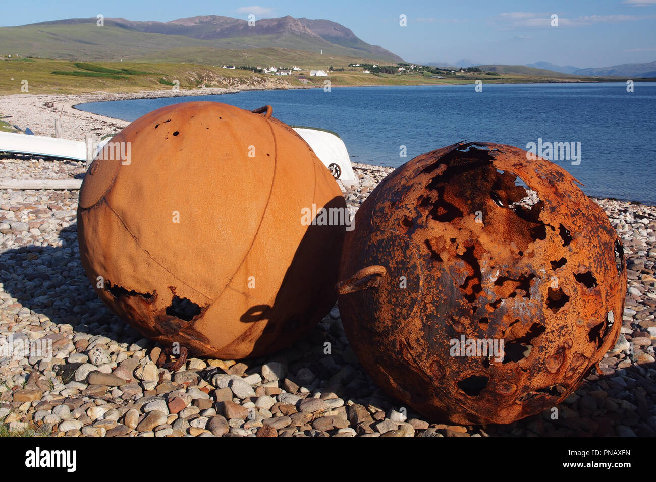 A view of broken, large, discarded iron sea floats on Badentarbat beach ...