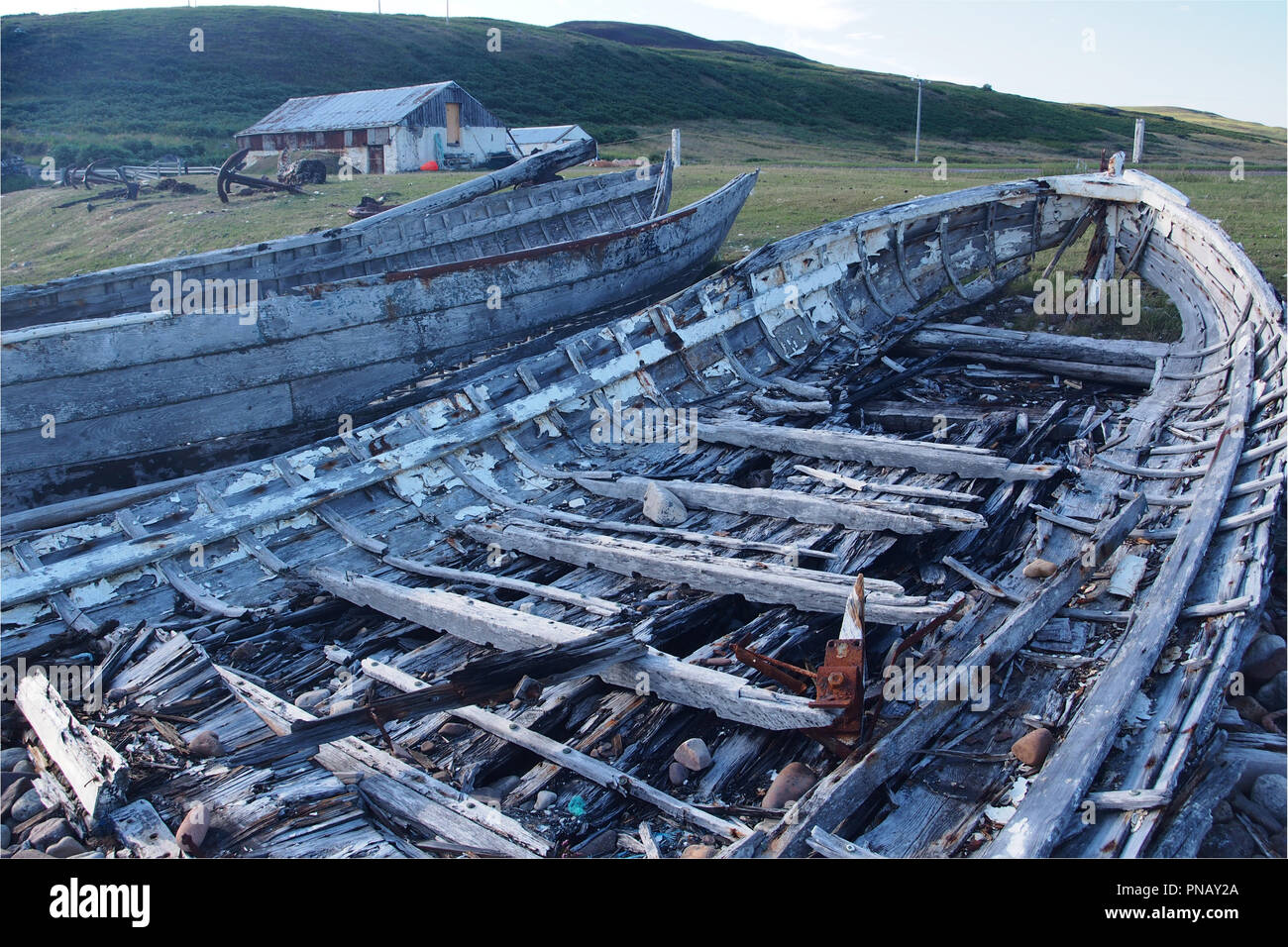 A view of the inside of the broken battered hull of a boat pulled up on ...