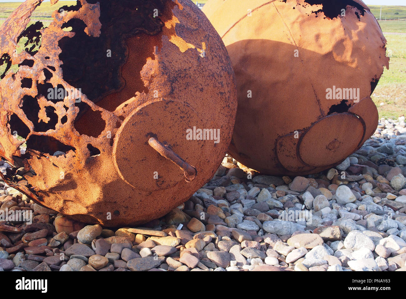 Large iron, discarded rusty sea floats disintegrating on Badentarbat ...