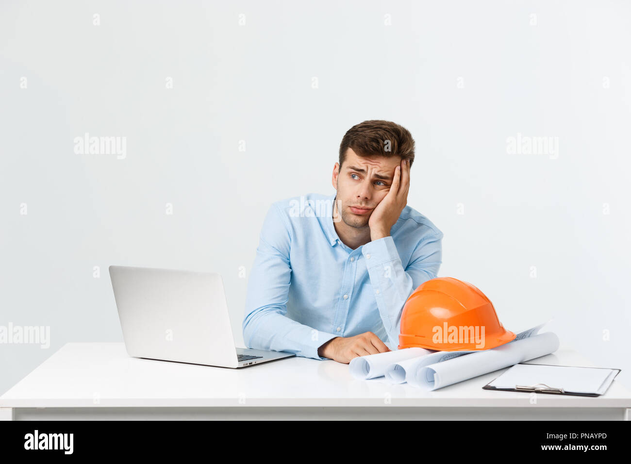 Focused Serious Hardworking Engineer Busy Working On Big Architectural