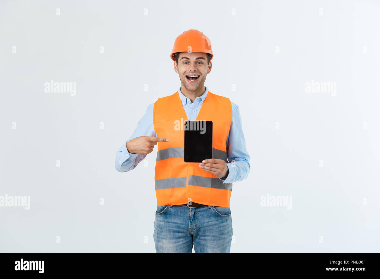 Engineer holding tablet mobile phone with blank black screen with copy ...