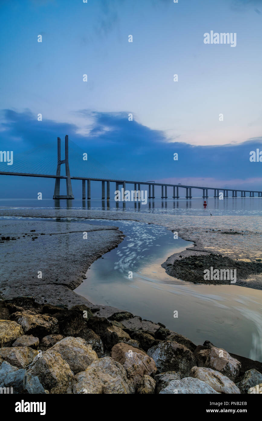 Amazing sunrise in the Vasco da Gama Bridge in Lisbon . Landscape of ...