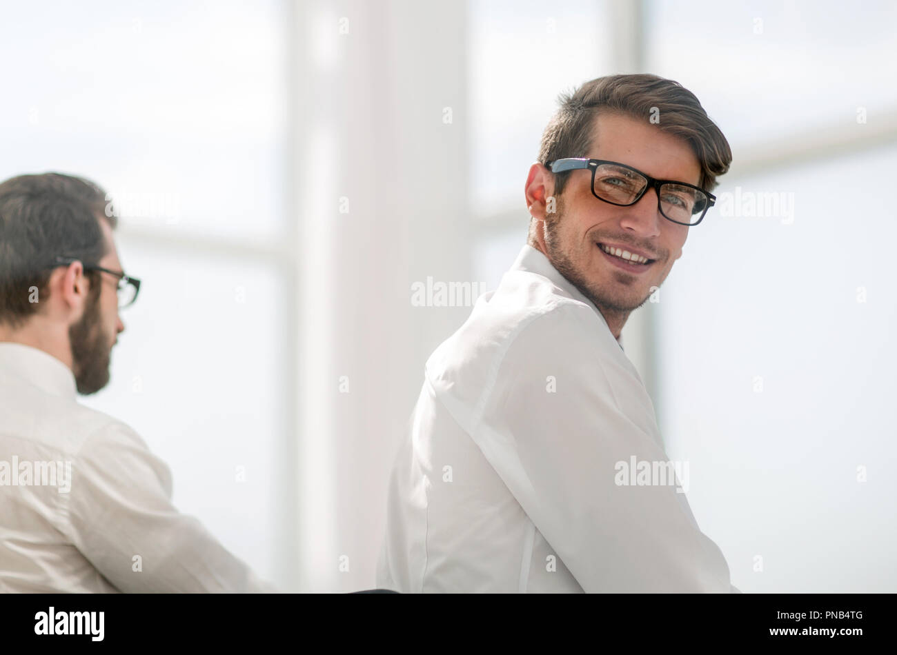rear view.employees in the workplace Stock Photo - Alamy