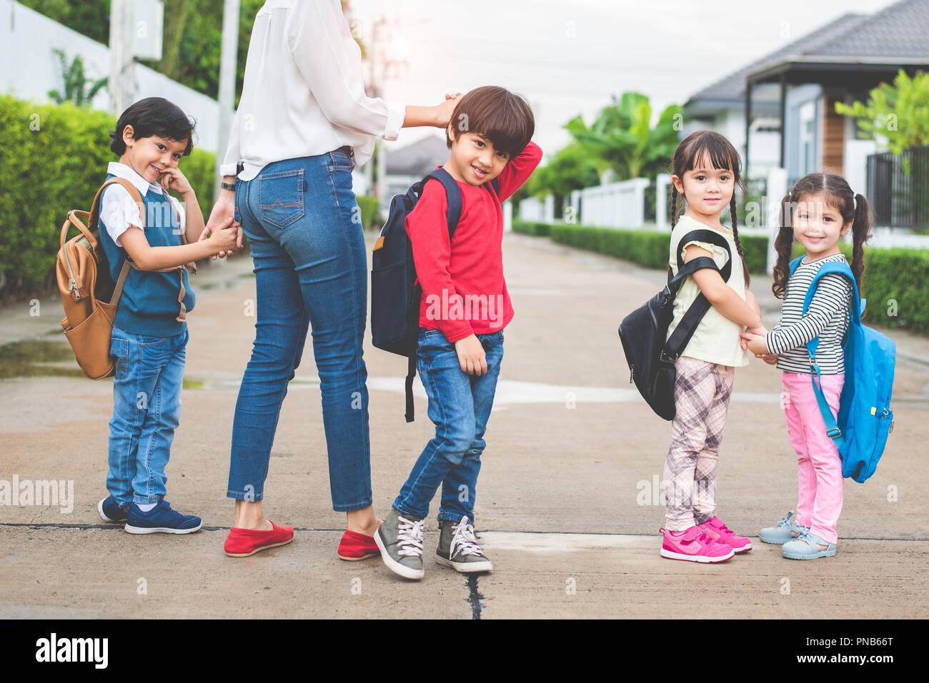 Back to school students mother group going school together. Parent send ...