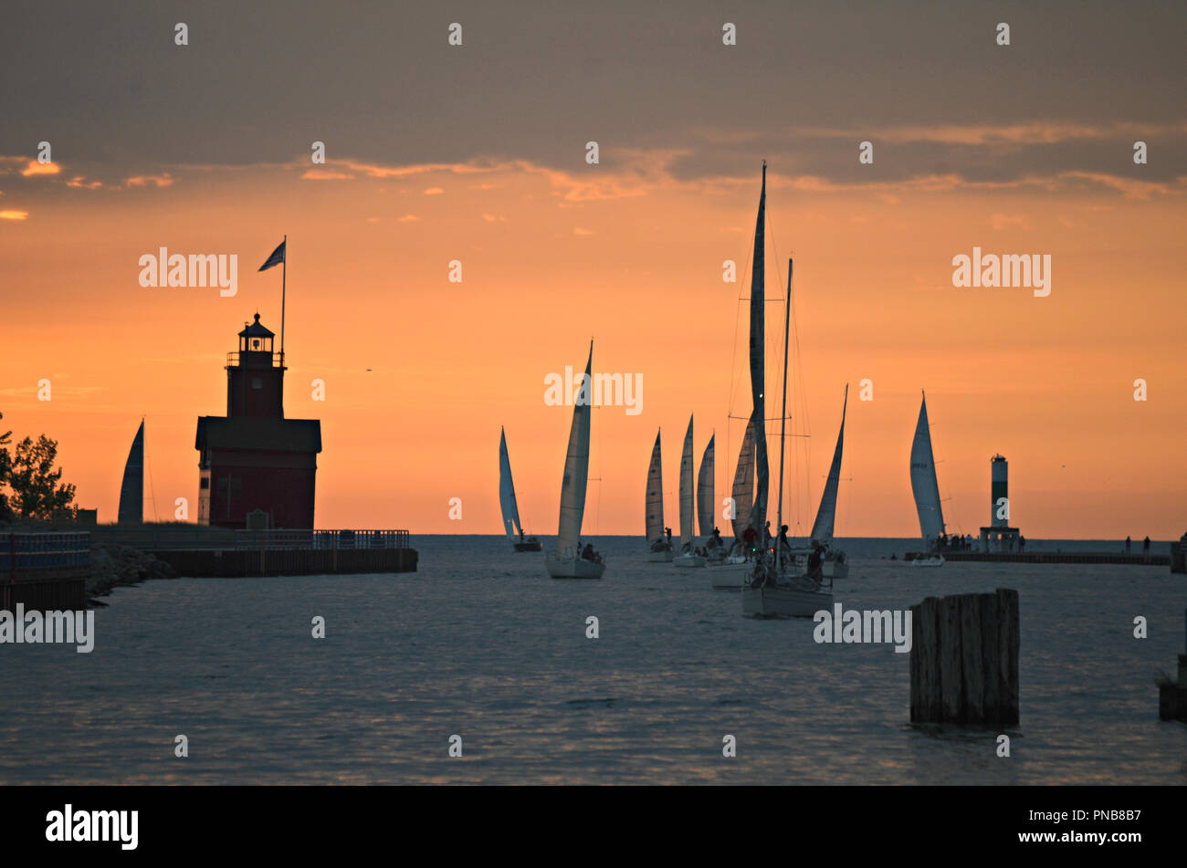 A multitude of sailboats in the channel at Holland, Michigan. Big Red ...