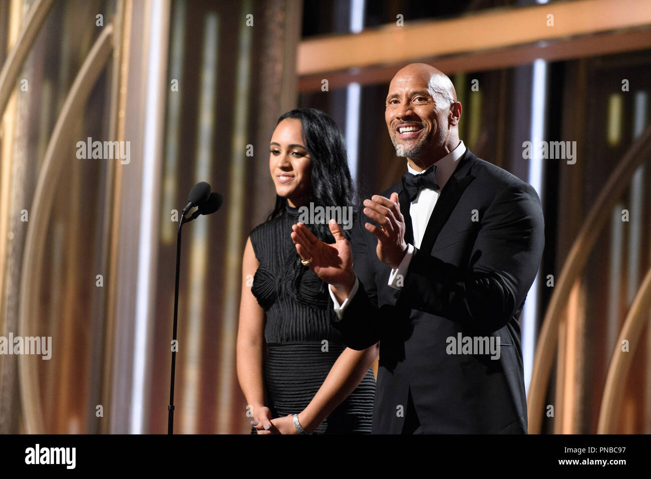 Golden Globe Ambassador Simone Garcia Johnson and Dwayne Johnson on ...