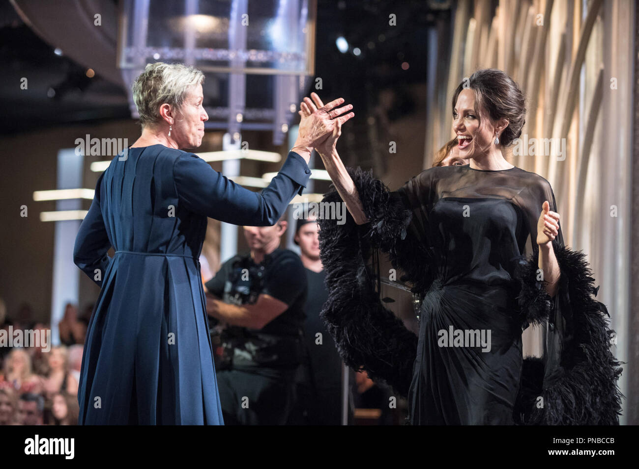 Isabelle Huppert and Angelina Jolie present the Golden Globe award for ...