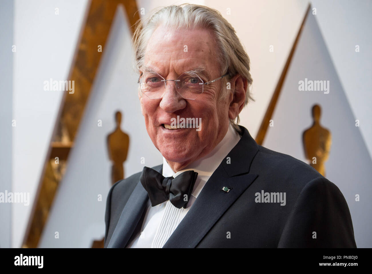 Honorary Oscars® recipient Donald Sutherland arrives on the red carpet ...