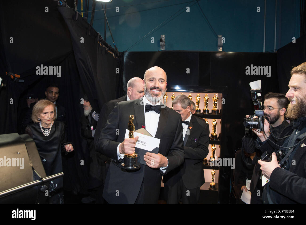 Mark Bridges poses backstage with the Oscar® for achievement in costume ...