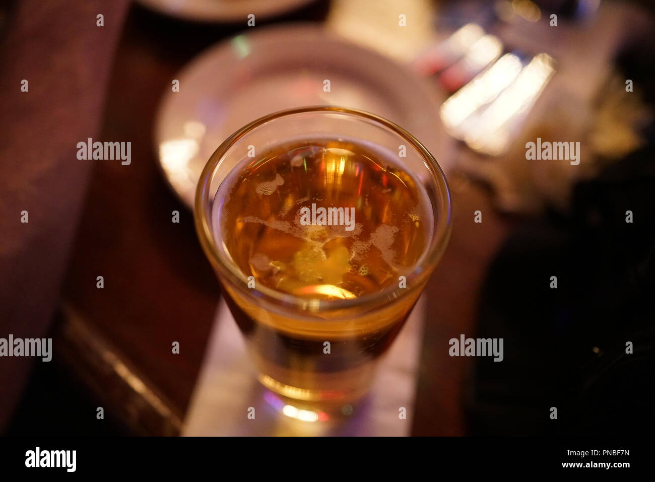 Close up shot of a full glass of beer from above Stock Photo - Alamy