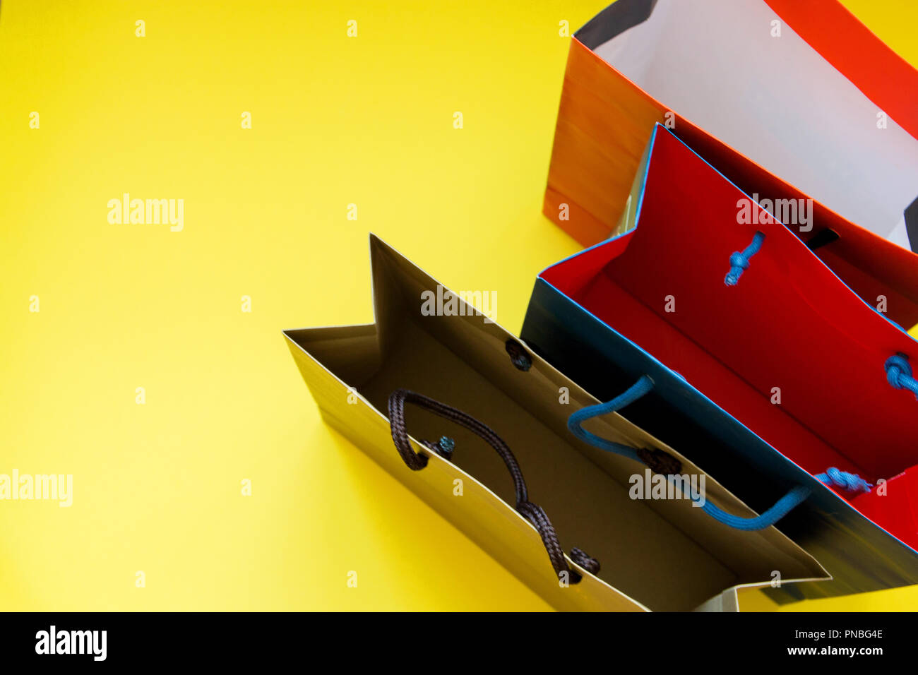 shopping paper bags top view on yellow background with copy space Stock ...