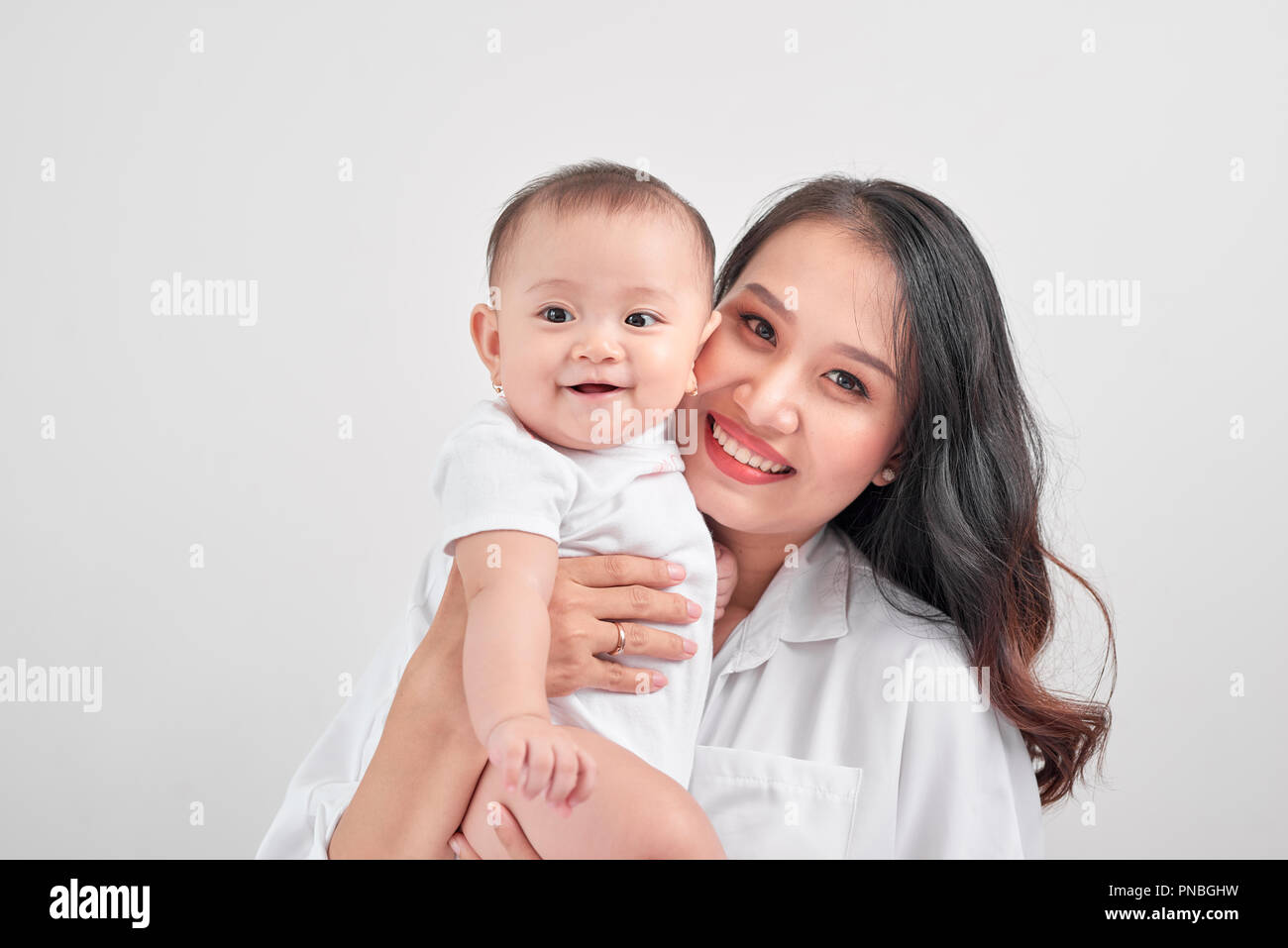 Happy loving family. Young smiling mother hugging laughing baby Stock ...