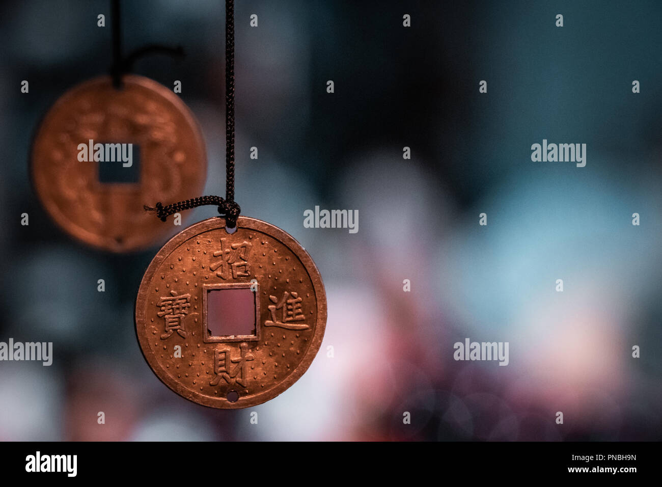 Oriental, magical pendants. Traditional Asiatic and Chinese currency ...