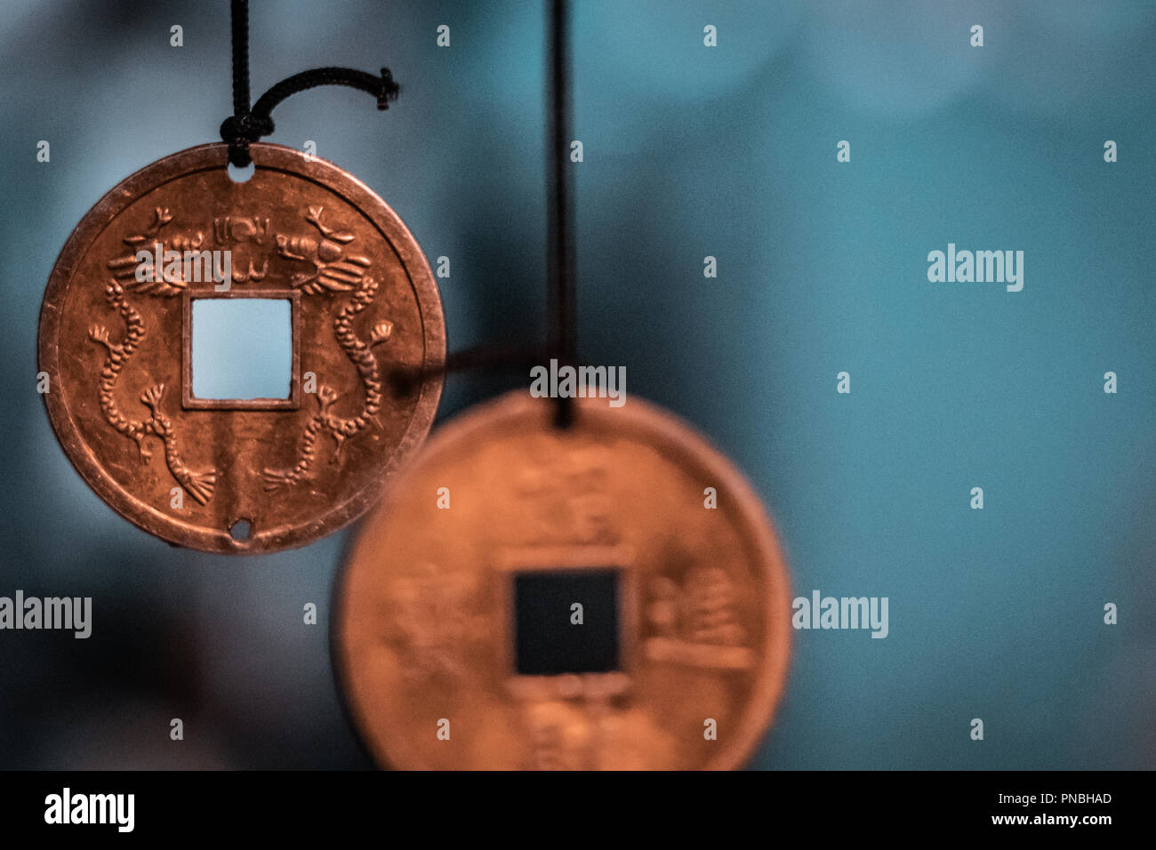 Oriental, magical pendants. Traditional Asiatic and Chinese currency ...