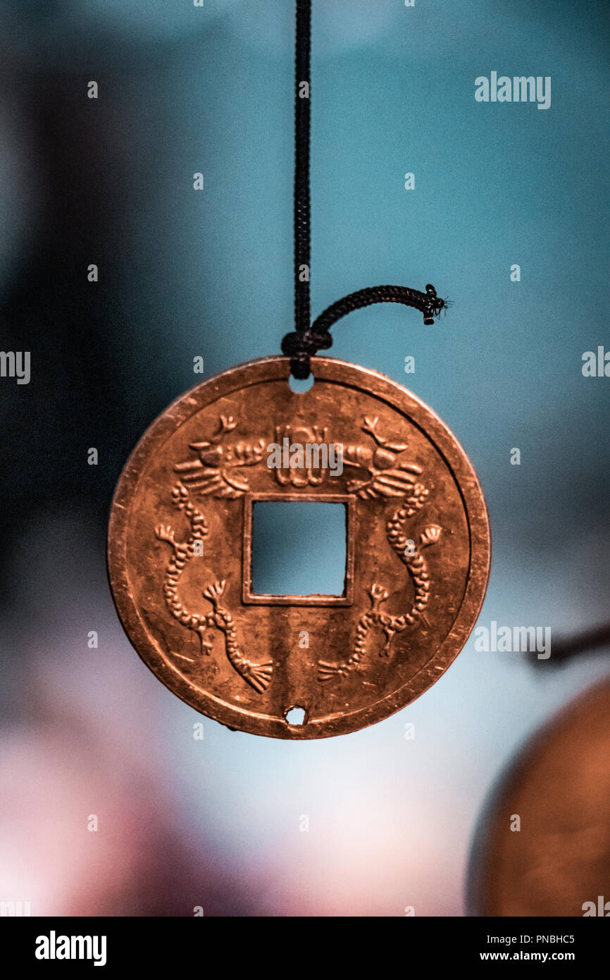 Oriental, magical pendants. Traditional Asiatic and Chinese currency ...