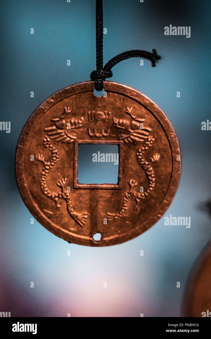 Oriental, magical pendants. Traditional Asiatic and Chinese currency ...