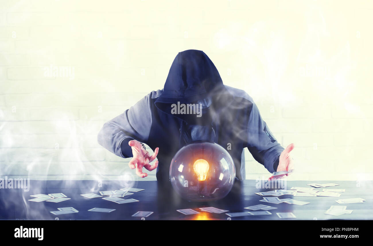 A man with a fortune teller ball Stock Photo - Alamy