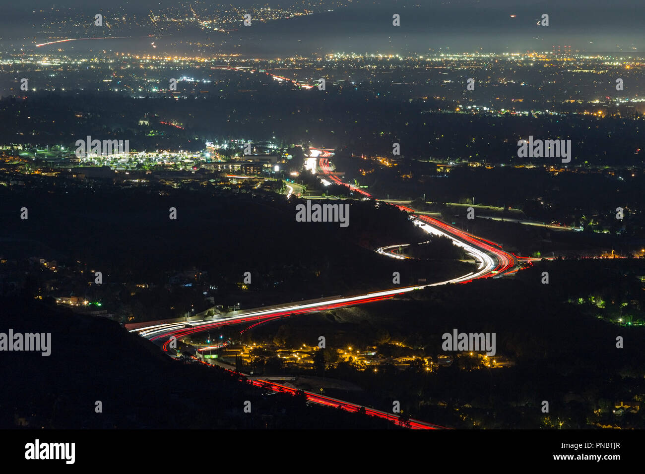 Predawn freeway traffic on route 118 through Porter Ranch in the San ...