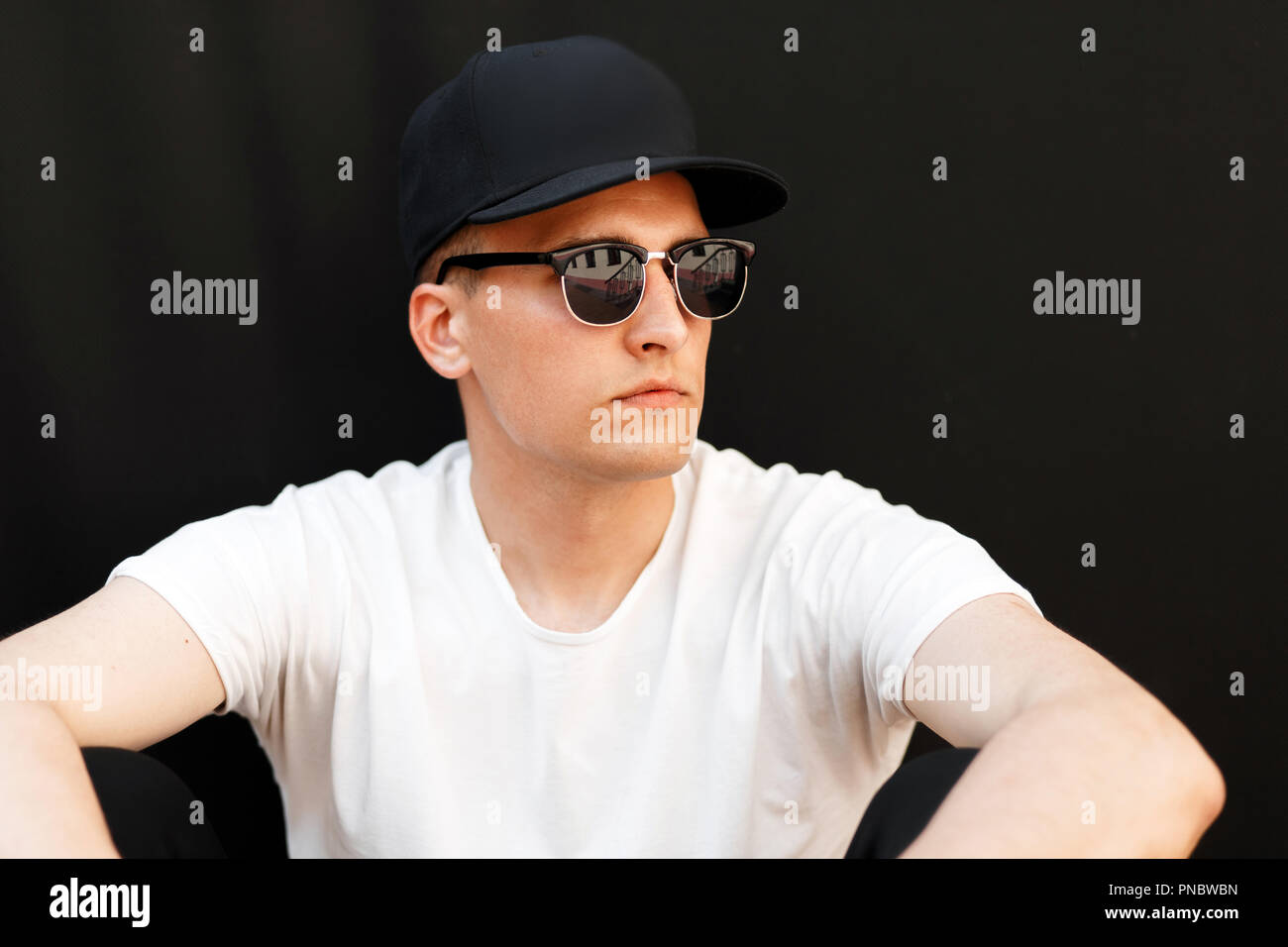 Portrait stylish young man wearing cap hi-res stock photography and ...