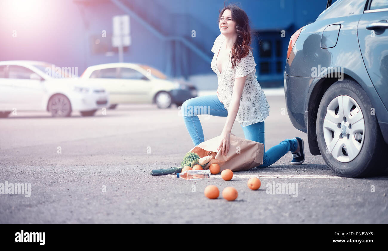 Girl with food coming out of the grocery store Stock Photo - Alamy