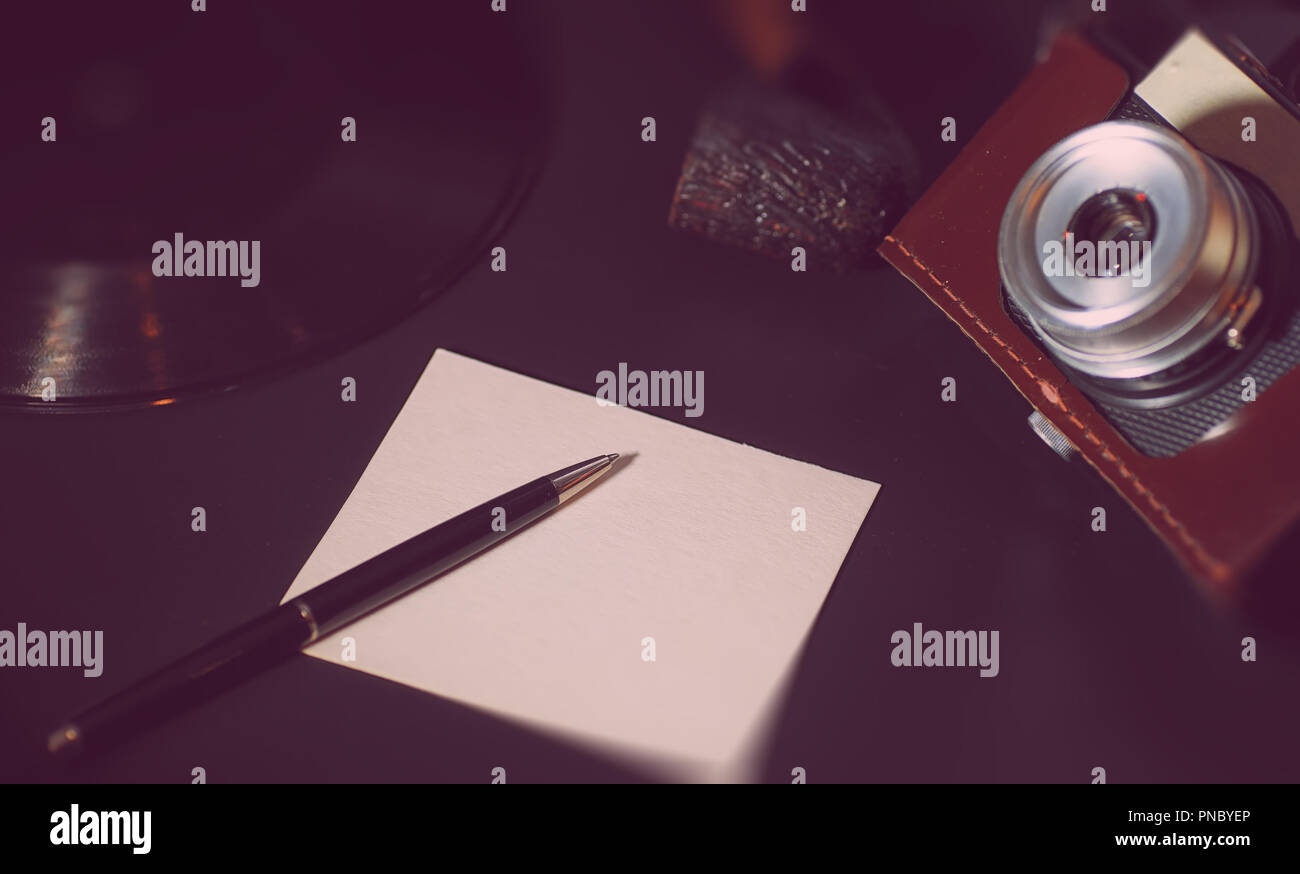 Vinyl plate and retro camera Stock Photo - Alamy